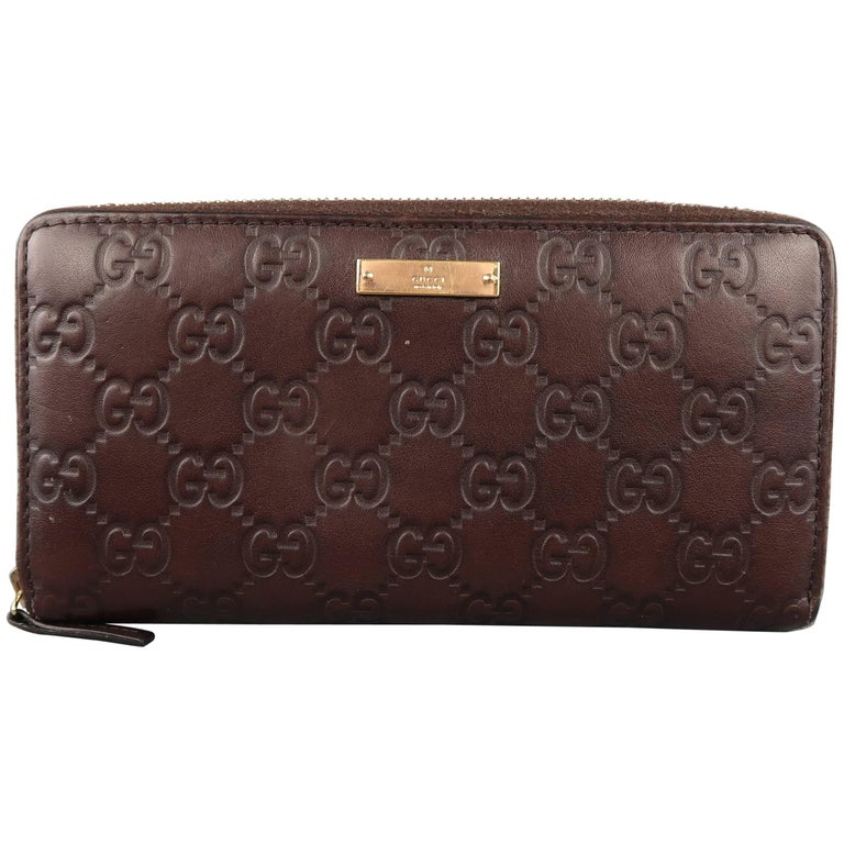 Gucci Brown Monogram Embossed Leather Zip Pocket Book Wallet at 1stDibs