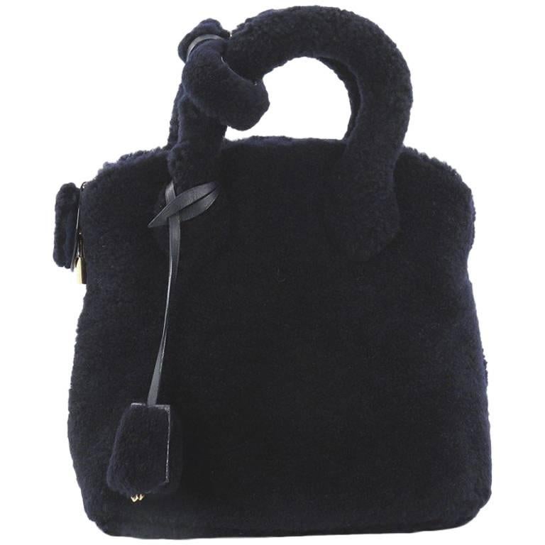 Louis Vuitton Lockit Shearling Handbag at 1stDibs