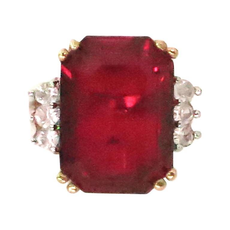 Faux emerald cut ruby and diamond ring set in gold at 1stdibs