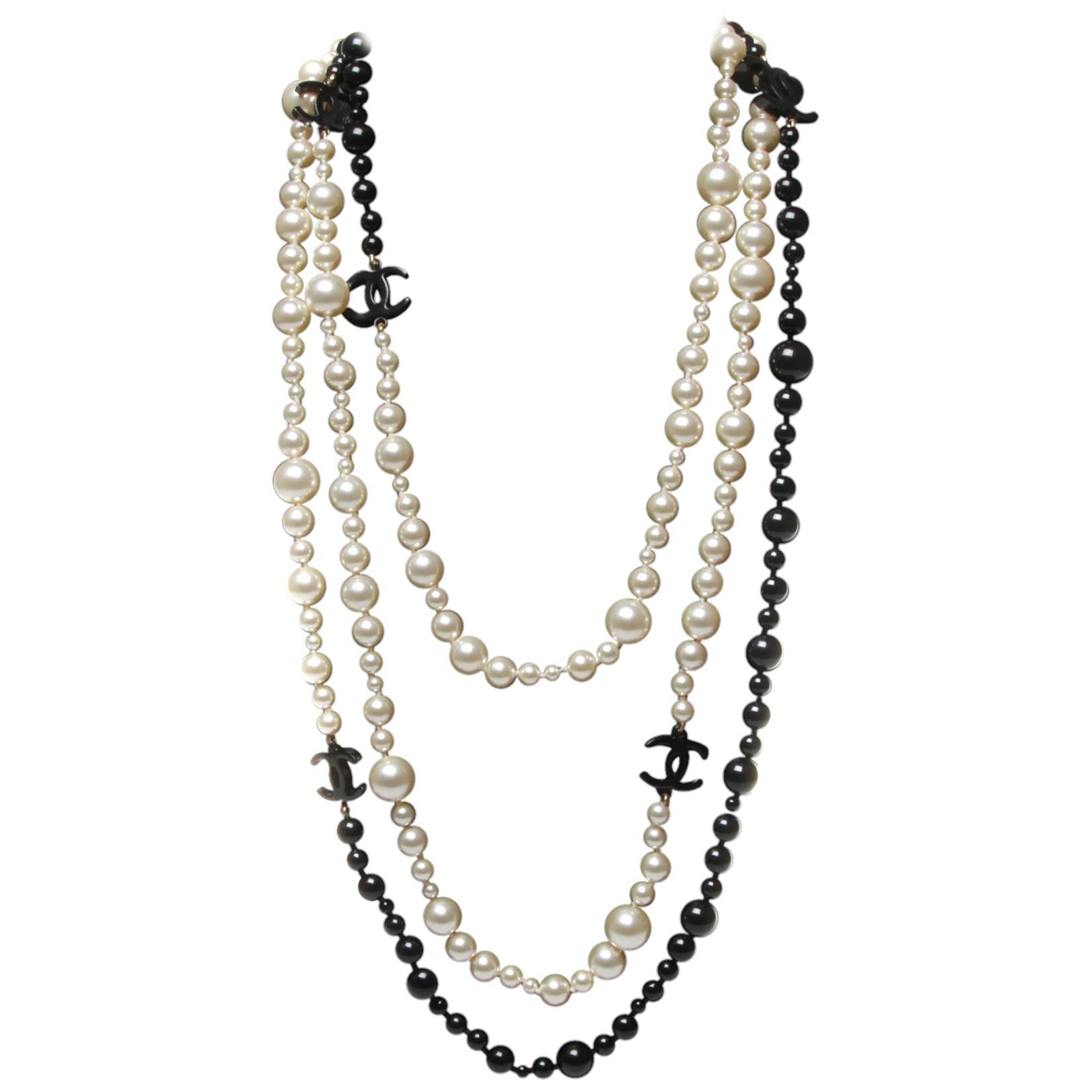 Chanel Black and pearl long triple chain with CC logos in black at 1stDibs