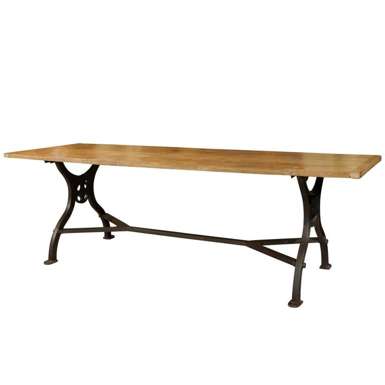 Dining Table with Industrial Iron Base and an Old Wooden Top at 1stDibs