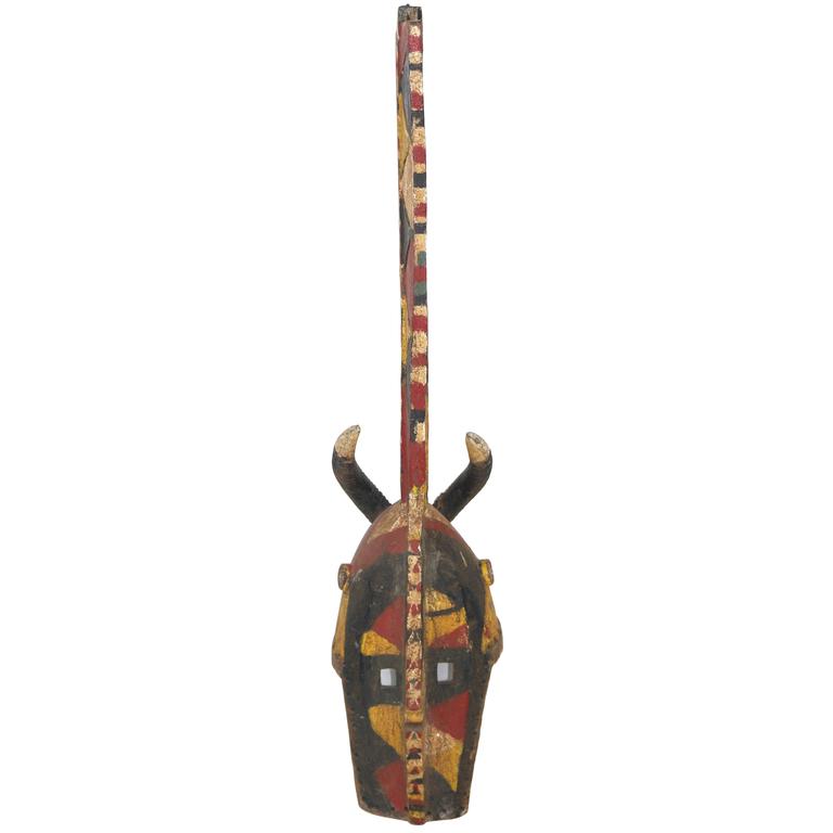 Powerful Tall Wood African Carved Pigmented Mask For Sale at 1stDibs