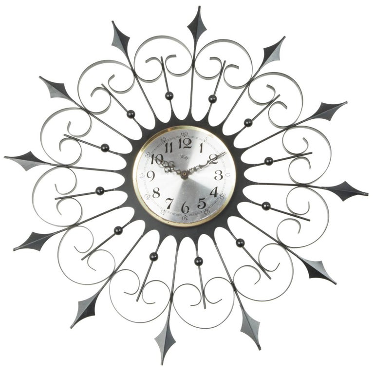 Welby Iron Sunburst Clock, circa 1950 at 1stDibs