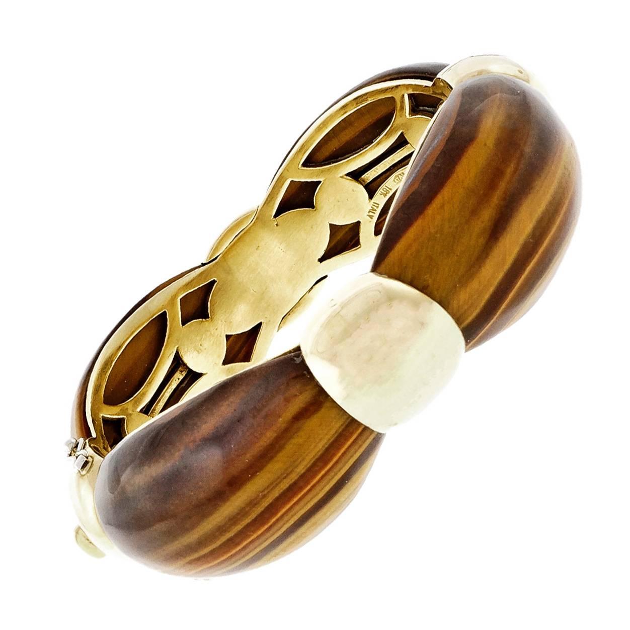 VAN CLEEF and ARPELS. A Yellow Gold Ivory Hinged Bangle. at 1stDibs