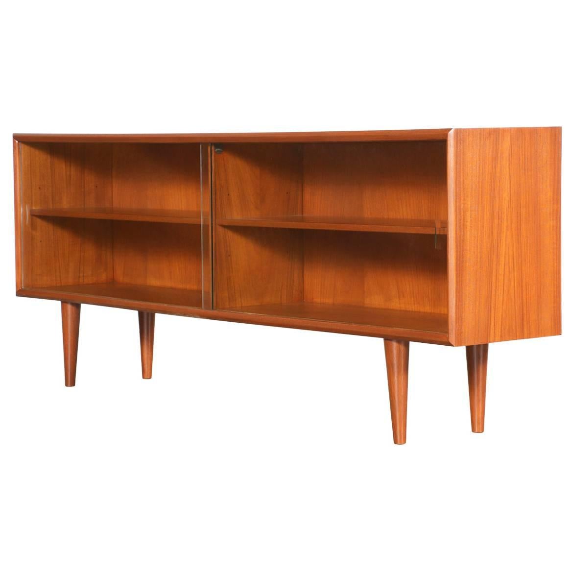 Danish Modern Low Profile Teak Bookcase with Sliding Glass Doors at 1stDibs