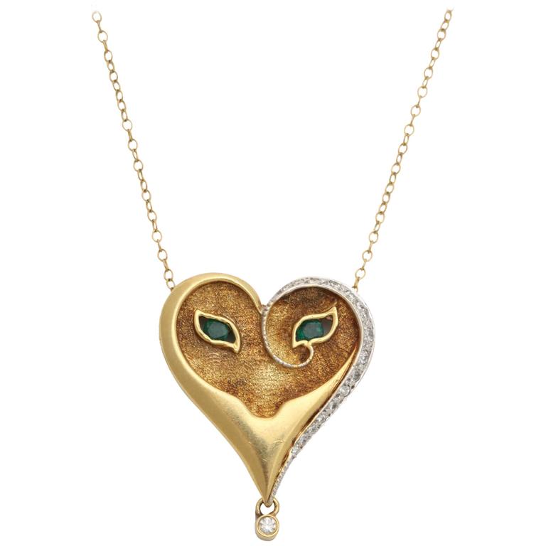 Erte Gold Heart Mask Necklace Diamonds and Emeralds at 1stDibs