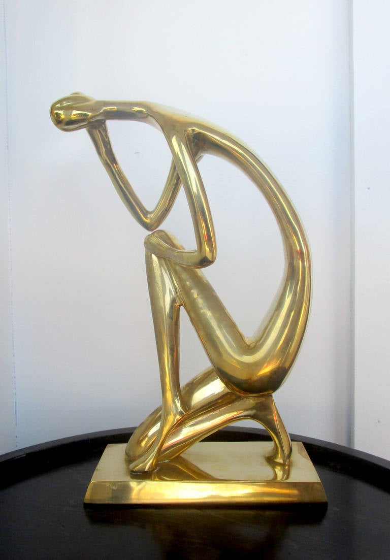 Stylized Brass Sculpture of a Woman at 1stDibs