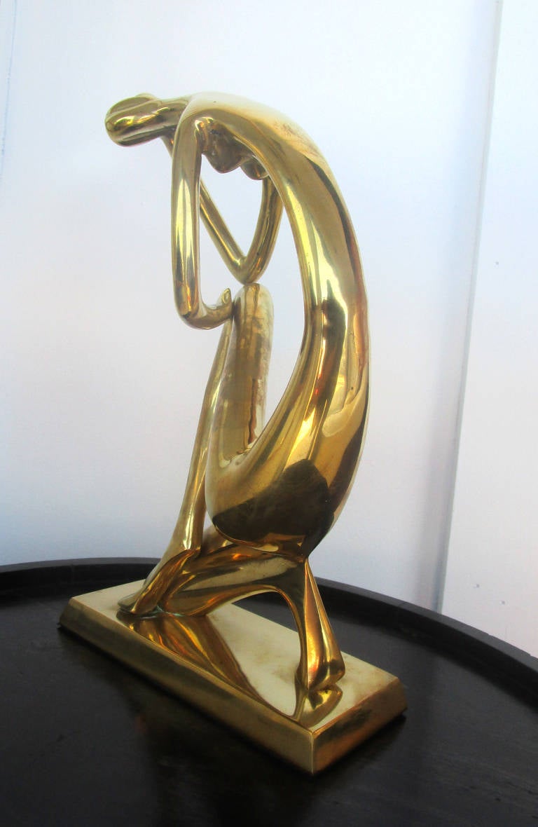 Stylized Brass Sculpture of a Woman at 1stDibs