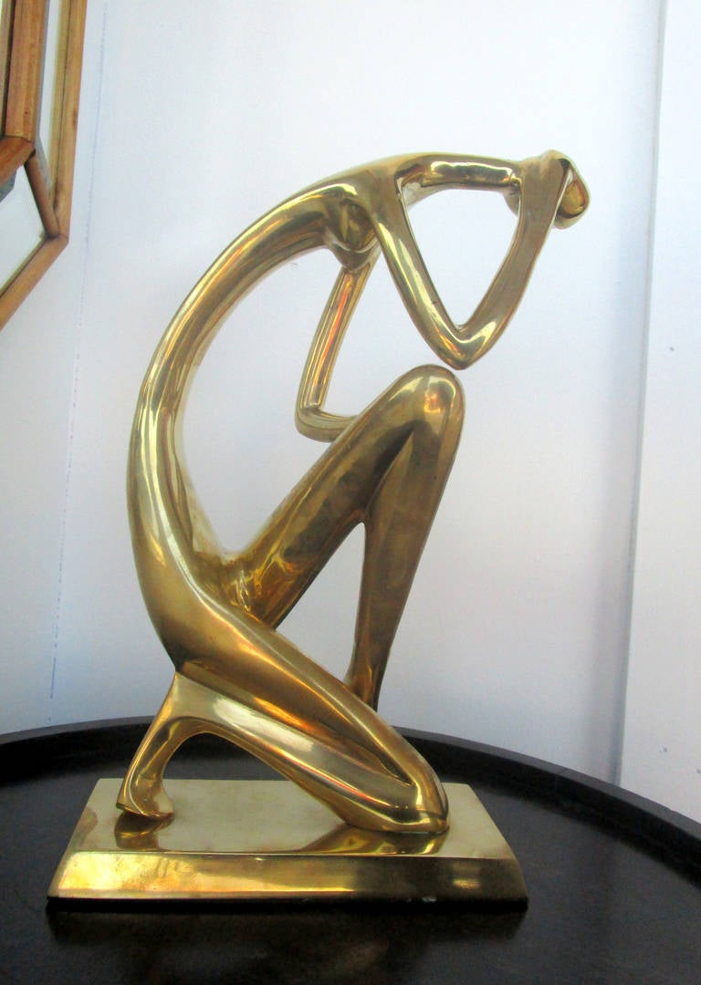 Stylized Brass Sculpture of a Woman at 1stDibs