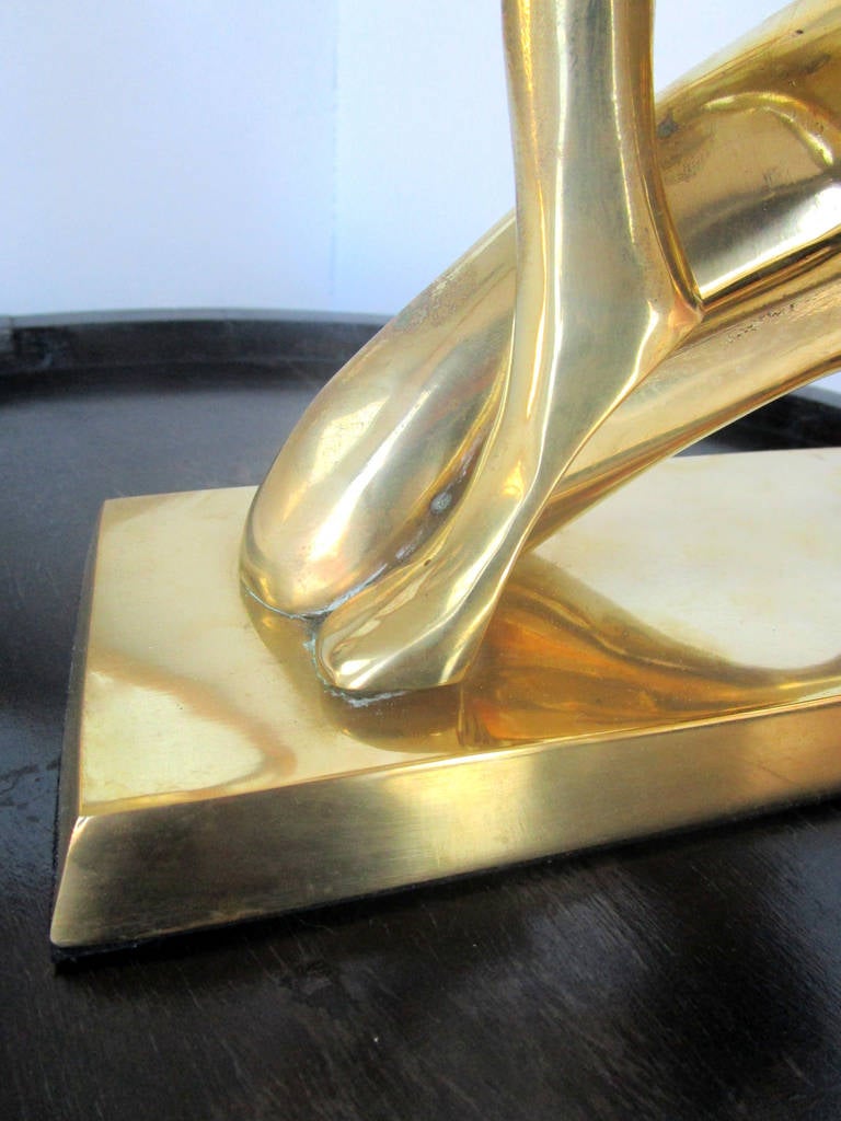 Stylized Brass Sculpture of a Woman at 1stDibs