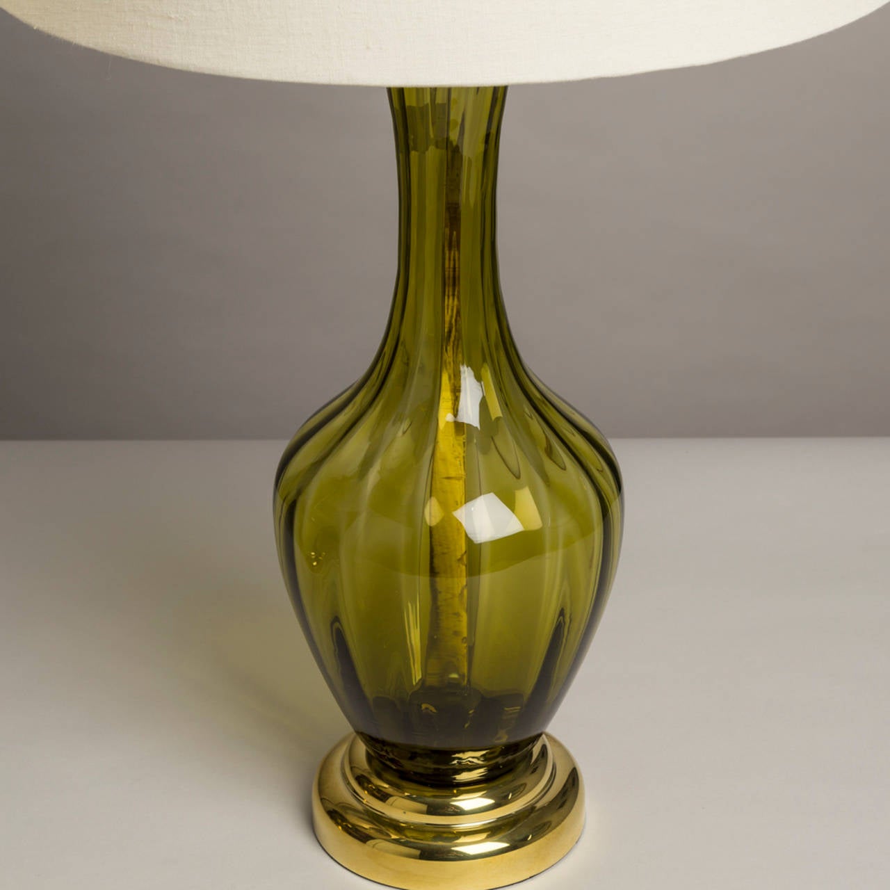 A Pair of Olive Green Glass Table Lamps on Circular Bases at 1stDibs