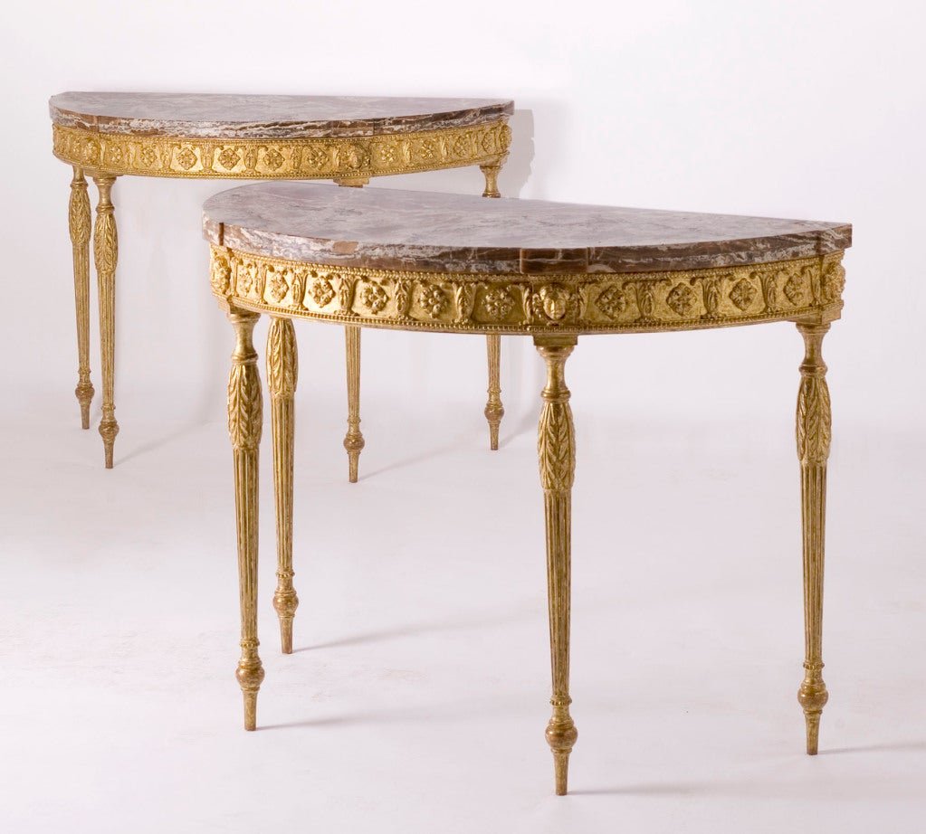 A pair of George III marble-topped demi-lune console tables. at 1stDibs