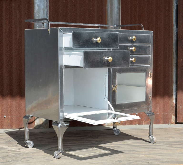 Petit Polished Cabrio Leg Steel Cabinet at 1stDibs