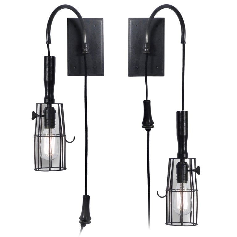 Unique Pair of Articulated Cage Sconces at 1stDibs