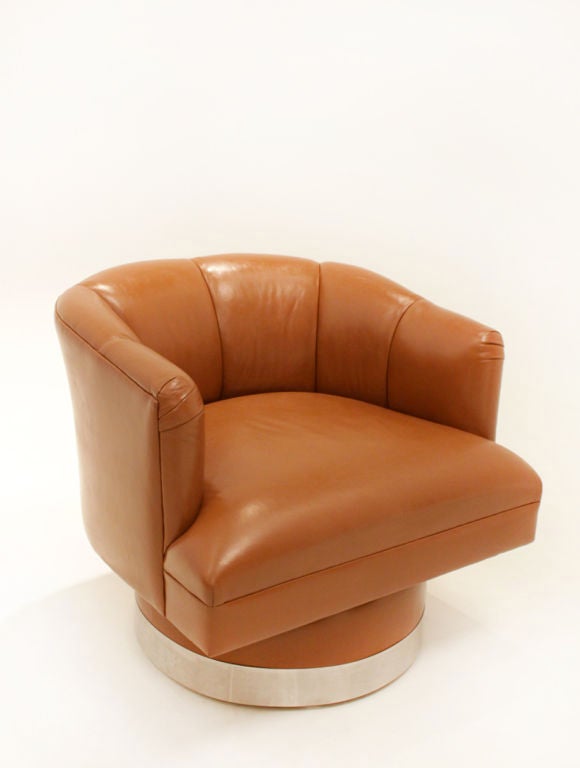 Pair of caramel leather chrome base swivel chairs at 1stDibs