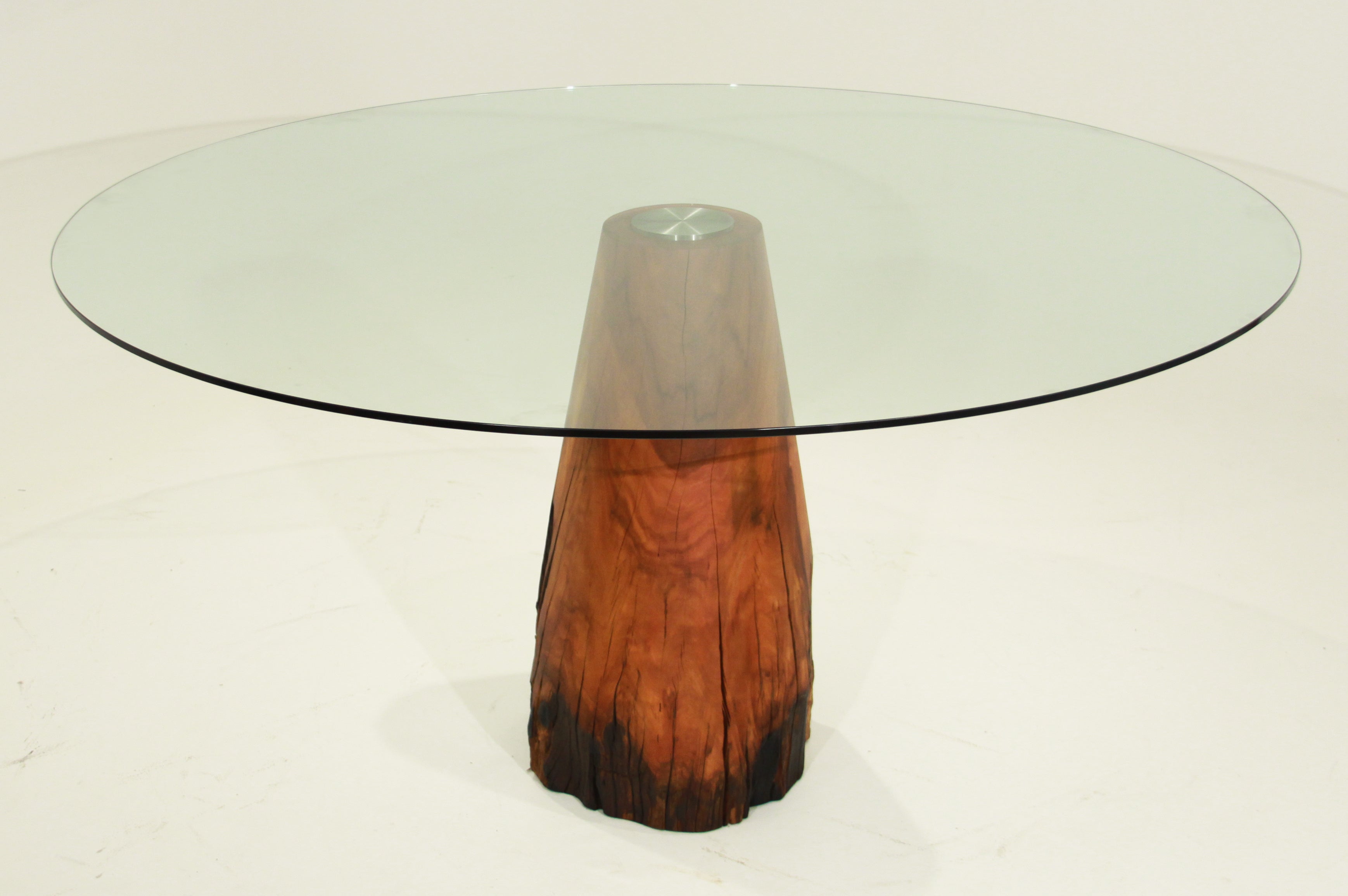 Circular Peroba Rosa pedestal-base dining table by Tunico T. at 1stDibs