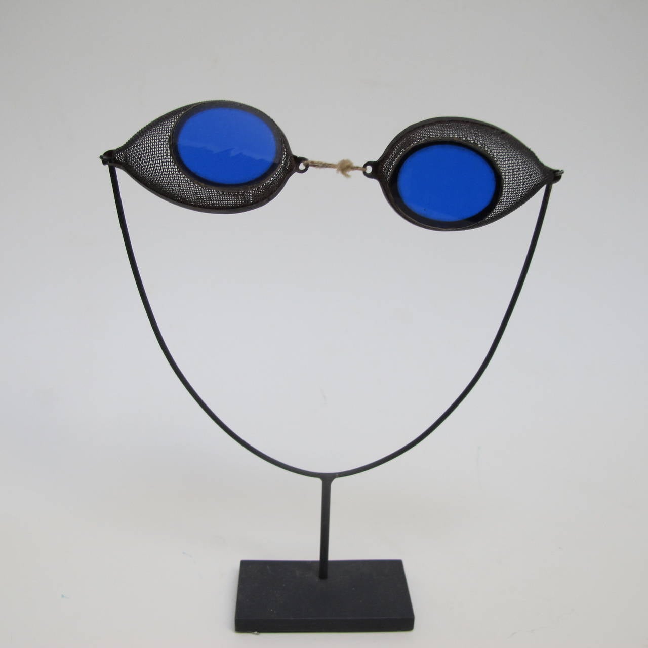 Blue Glass Goggles on Base at 1stDibs