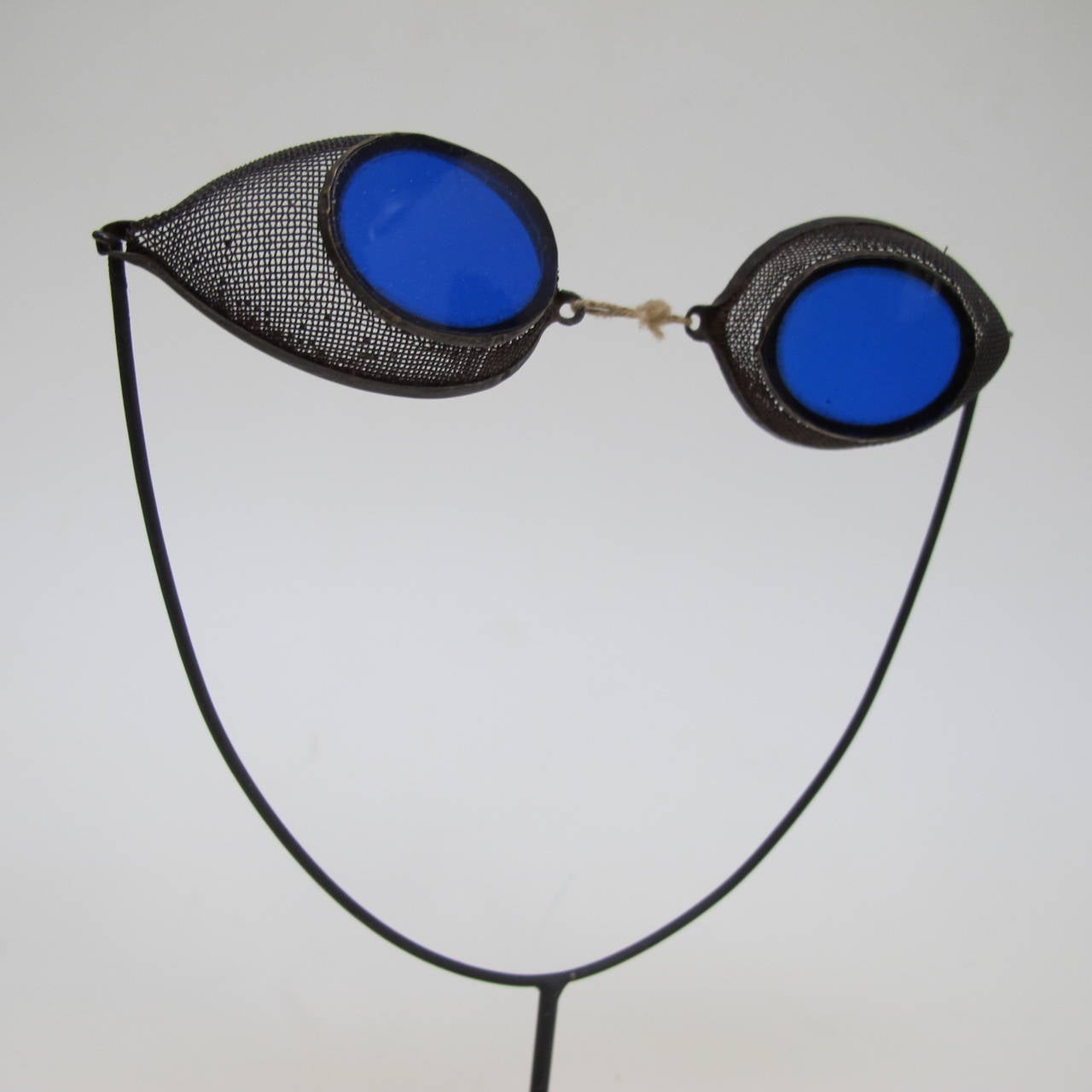 Blue Glass Goggles on Base at 1stDibs