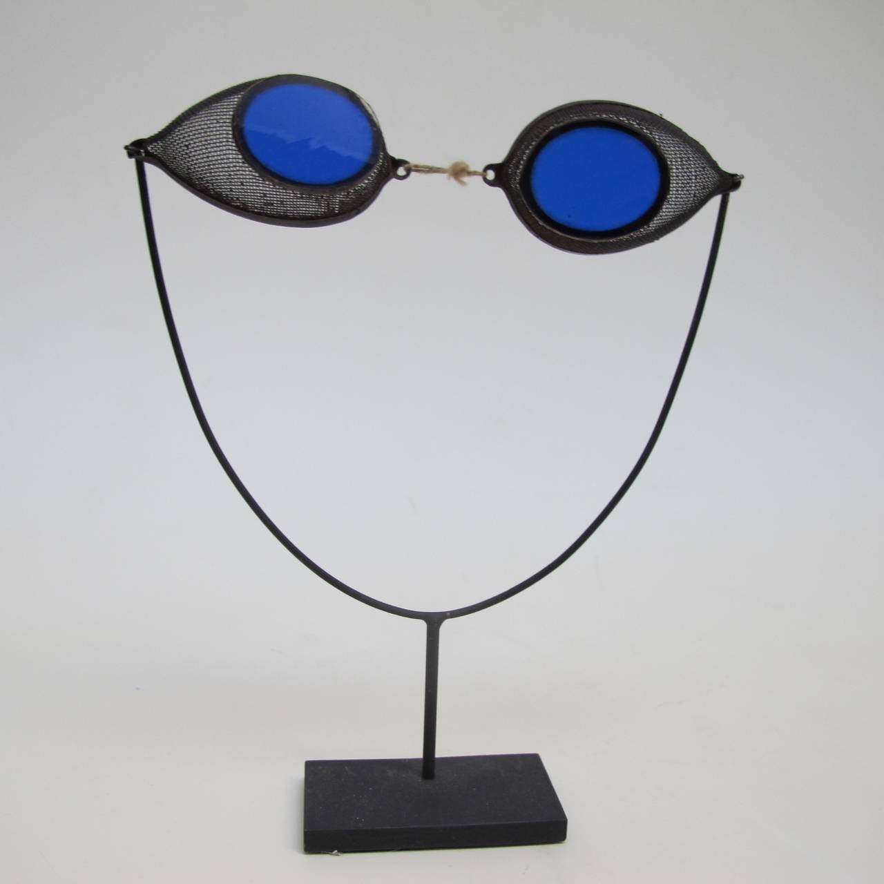 Blue Glass Goggles on Base at 1stDibs