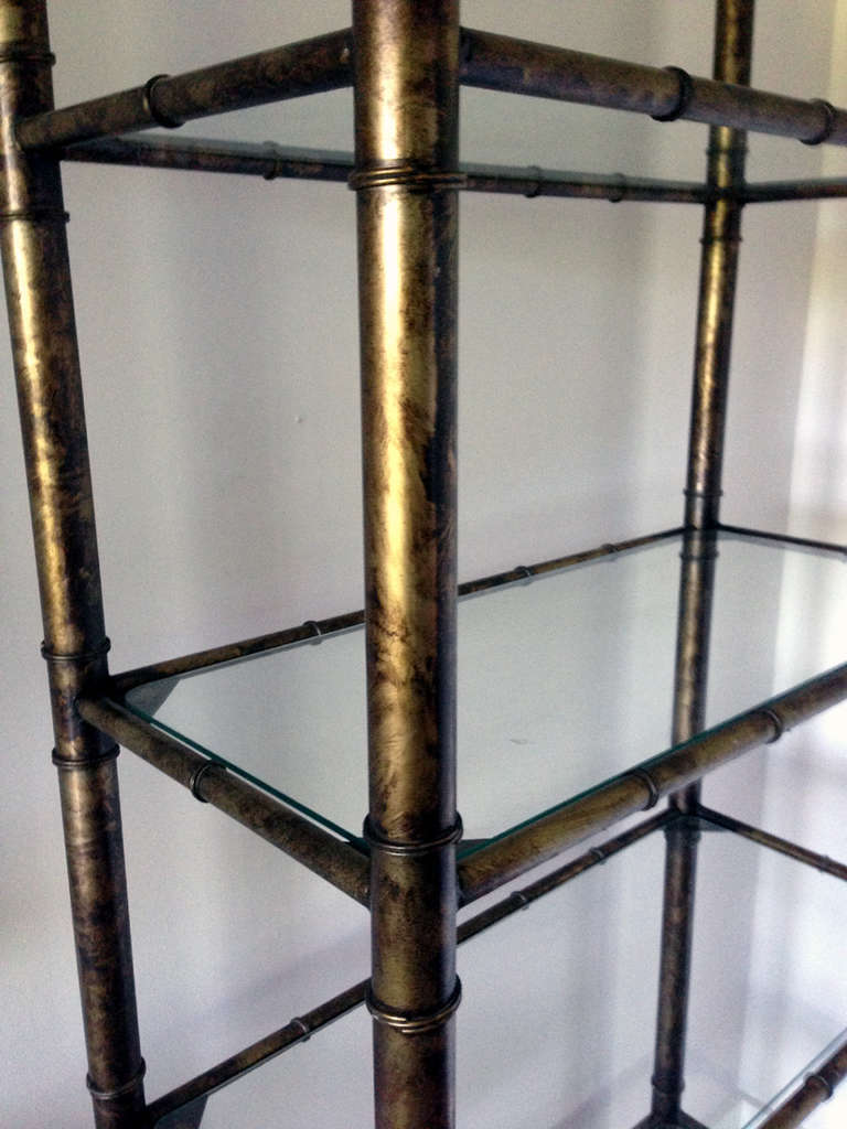 Pair Hollywood Regency shelves etagere patinated metal and glass at 1stDibs