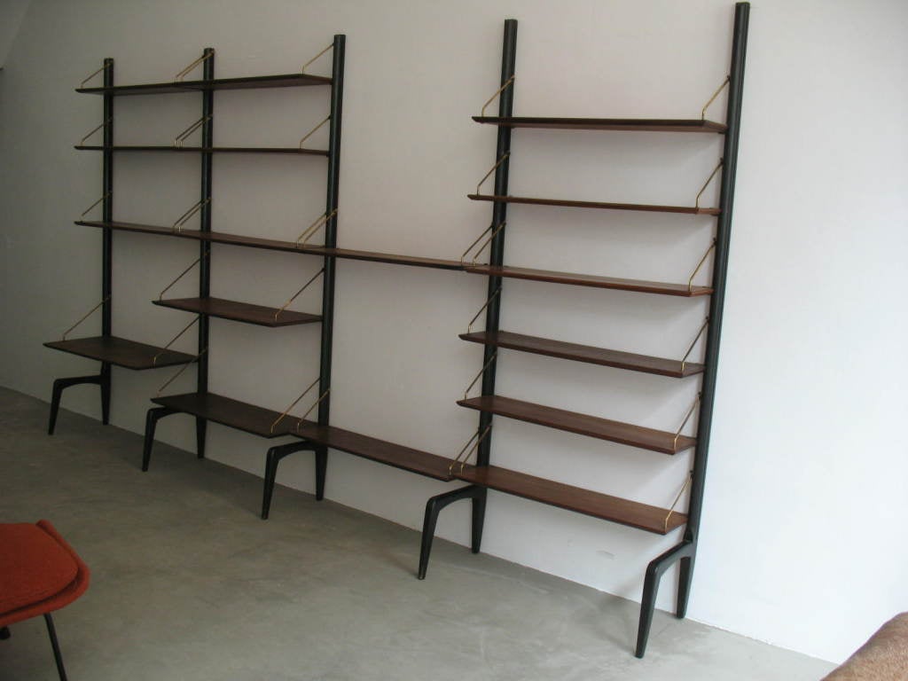shelving unit in teak with black legs at 1stDibs