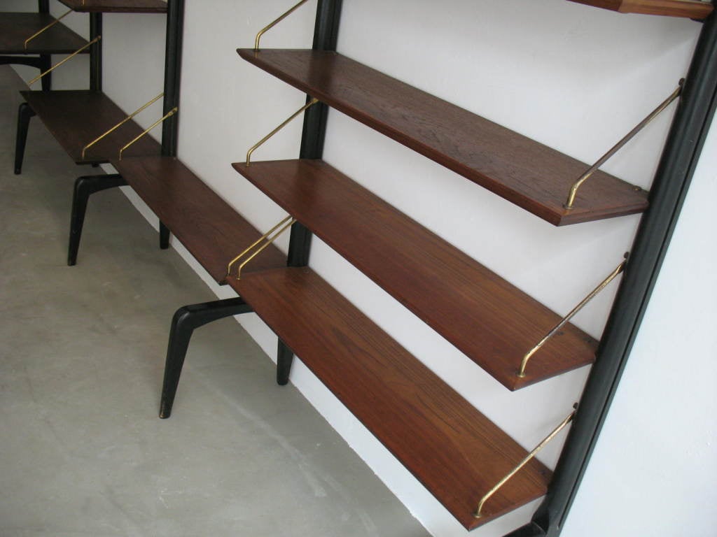shelving unit in teak with black legs at 1stDibs