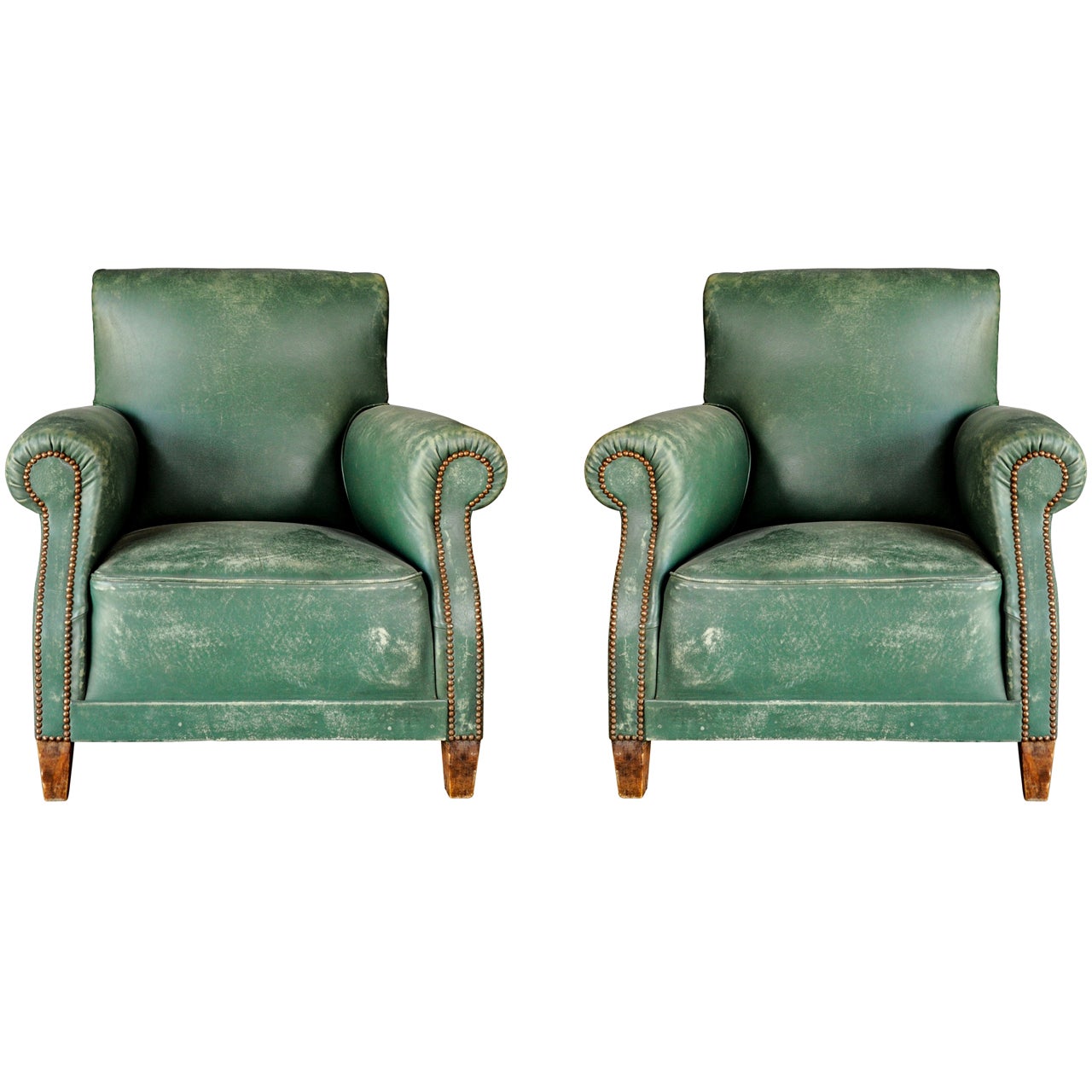 A pair of antique green leather club seats at 1stDibs