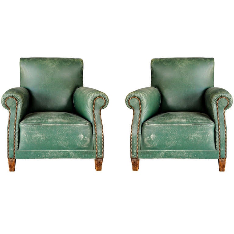 A pair of antique green leather club seats at 1stDibs
