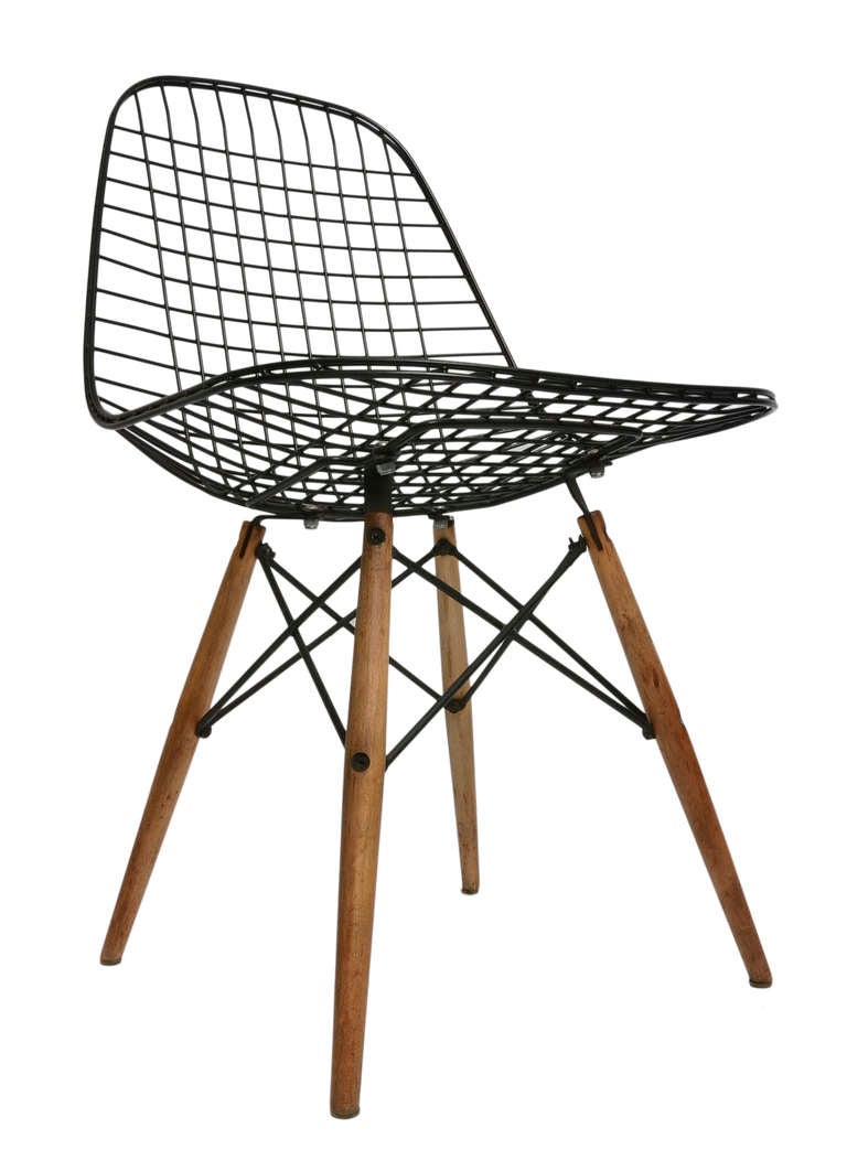 Early set of four Birch dowel base Eames wire chairs at 1stDibs