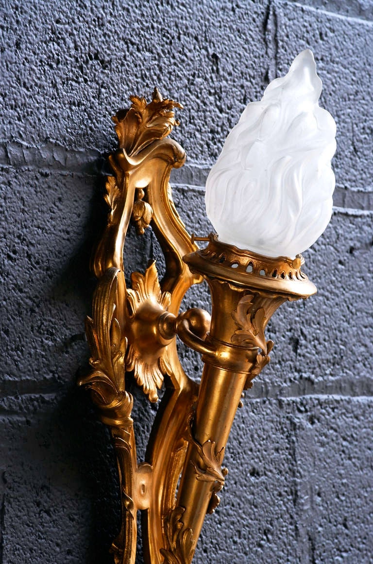 Flaming Bronze Torch Sconces at 1stDibs