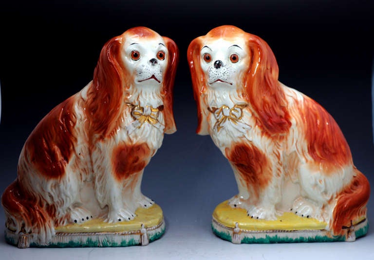Pair Of Staffordshire Pottery Spaniels With Glass Eyes Sitting On ...