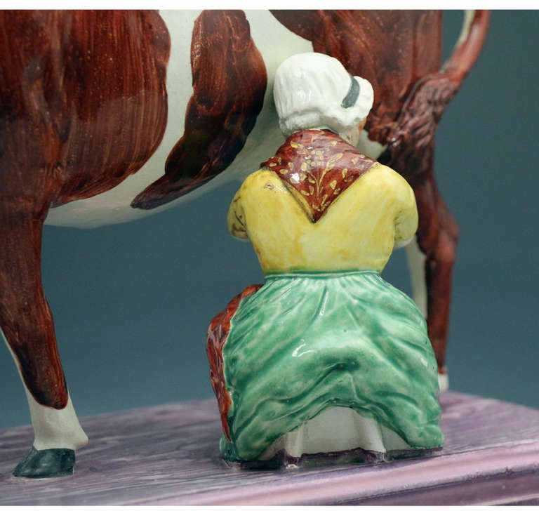 Large Figure of Cow and Milk Maid with a Pink Luster Base at 1stDibs
