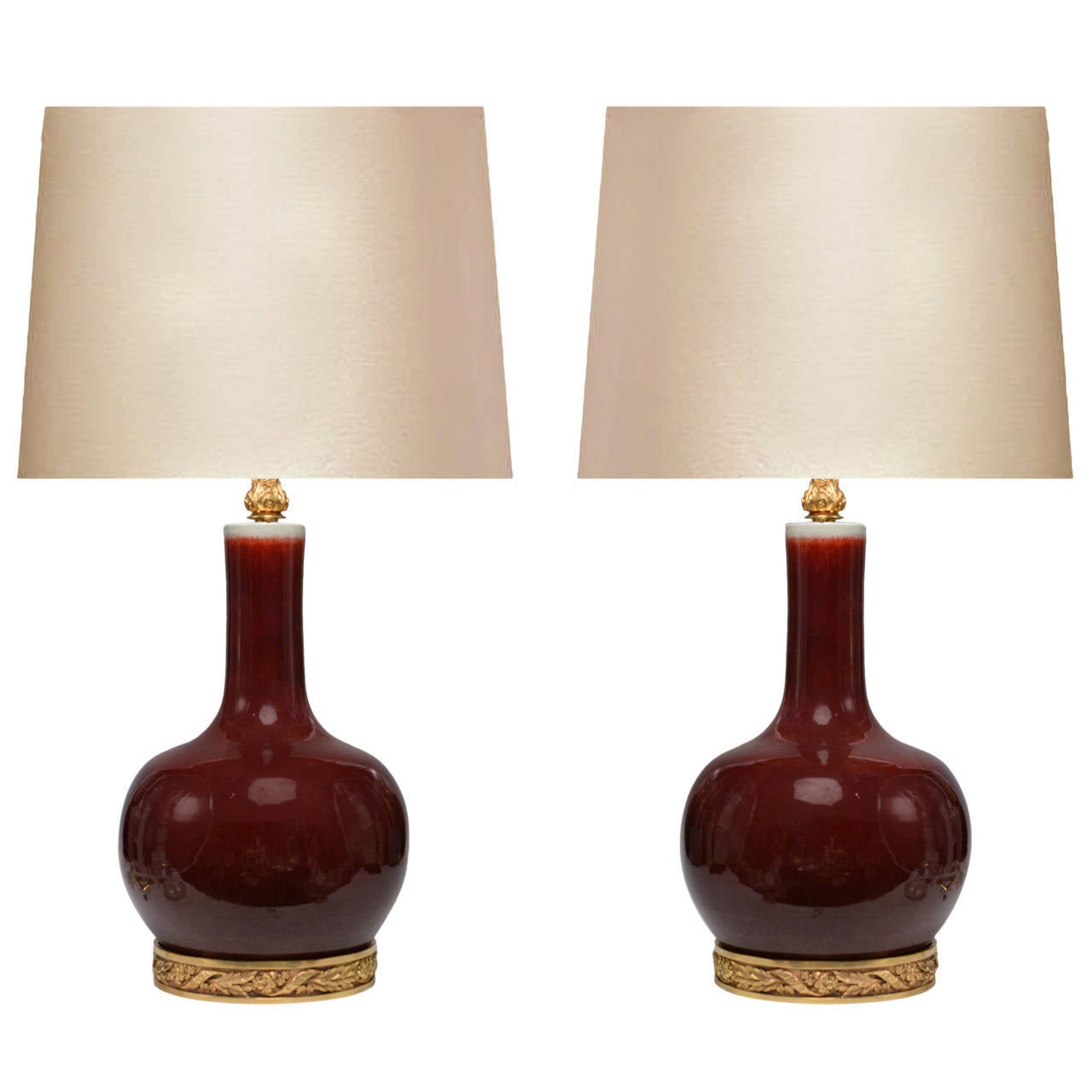 Pair of Copper Red Glazed Porcelain Lamps with Gilt Bronze Bases at 1stdibs