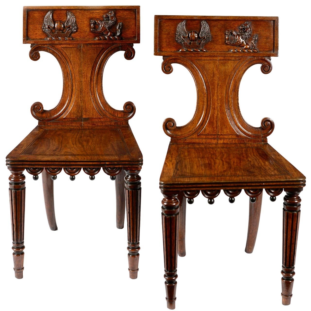 A pair of Regency brown oak hall chairs attributed to George Bullock at ...