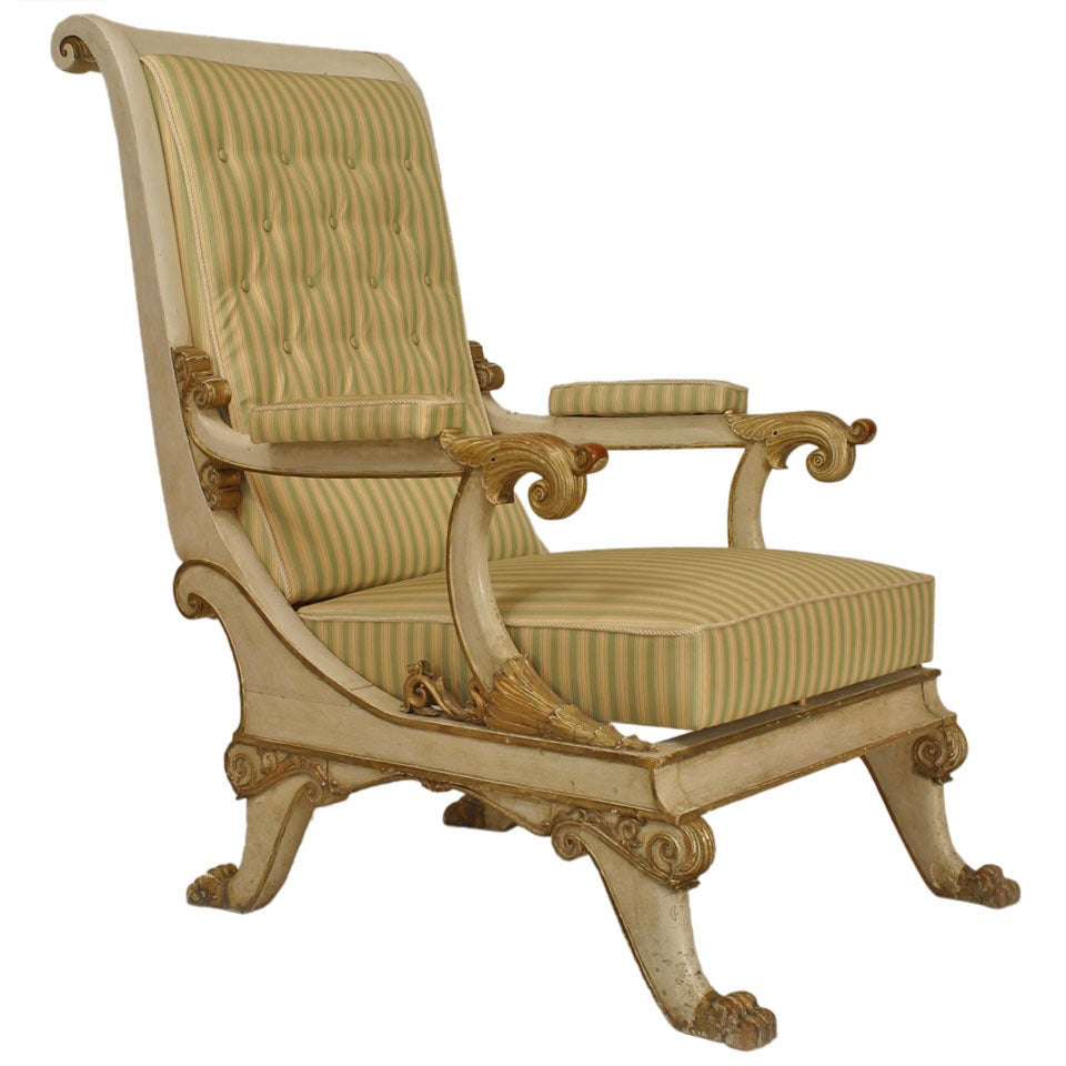 A pair of Regency ebonised and parcel-gilt open arm chairs at 1stDibs