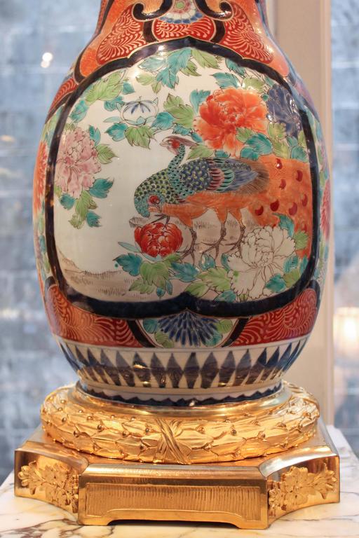 Pair of Japanese Kutani Urns on Gilt Bronze Pedestals For Sale at 1stDibs