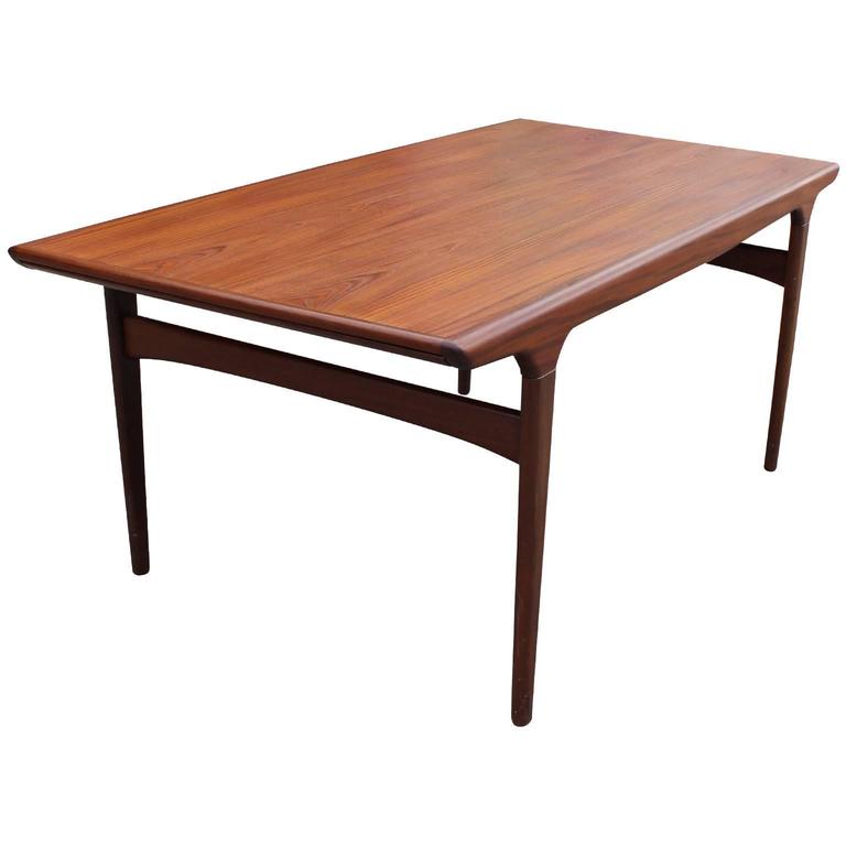 Elegant Danish Teak Dining Table with a Cantilevered Leaf at 1stDibs