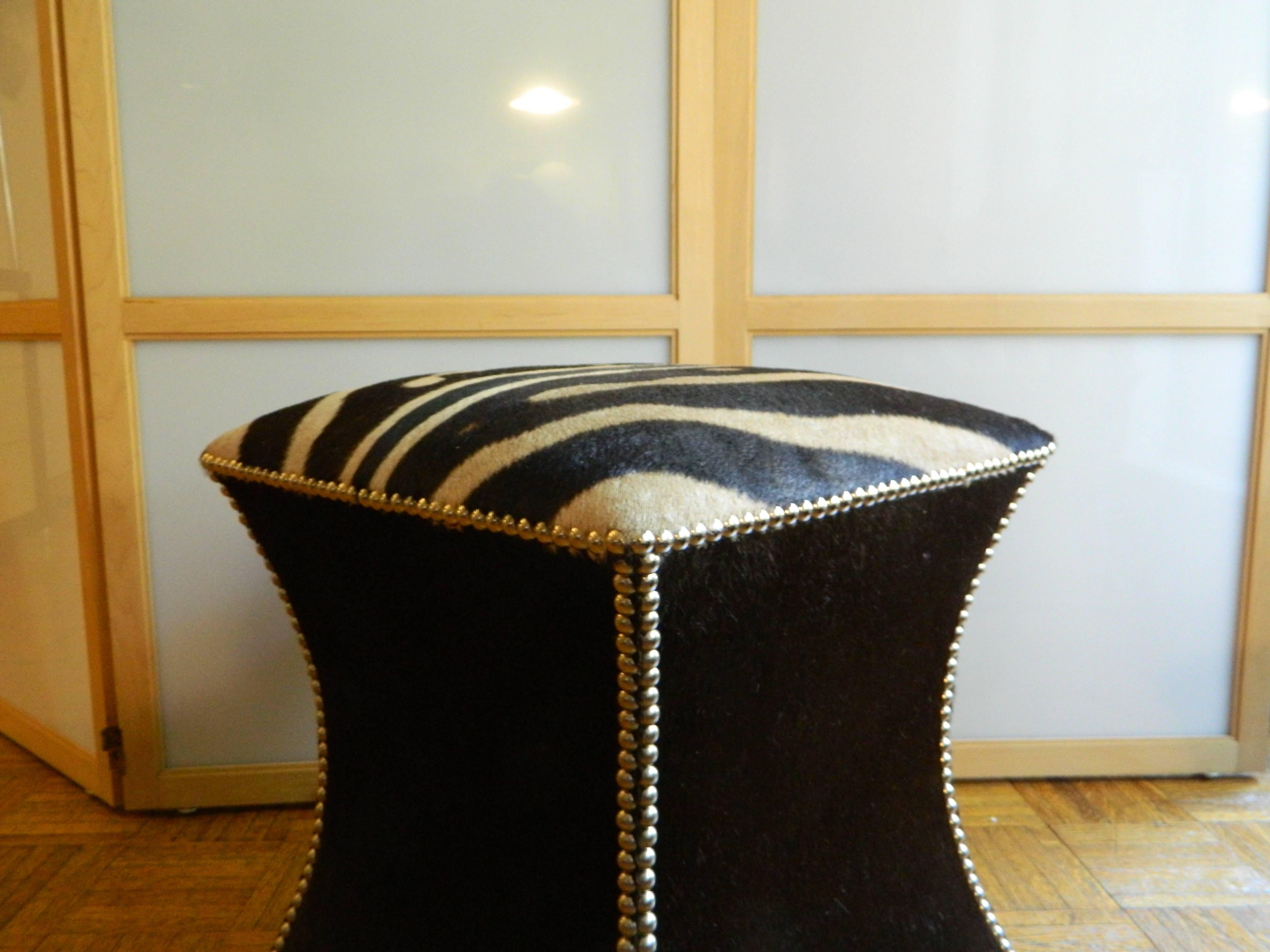 Burchell Zebra and cow hide ottomans For Sale at 1stDibs