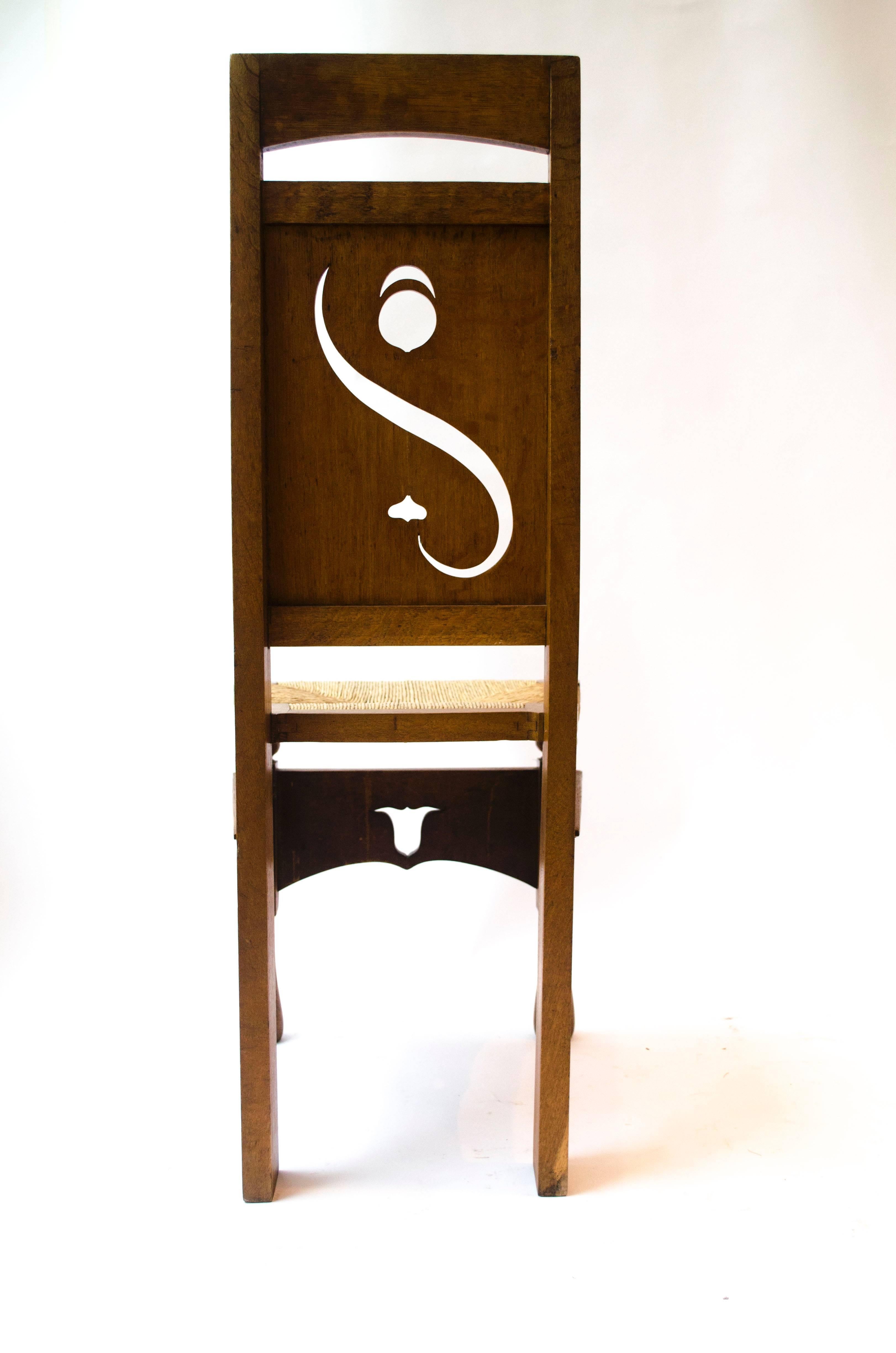 M H Baillie Scott attri An Arts and Crafts Oak Chair With Stylised ...