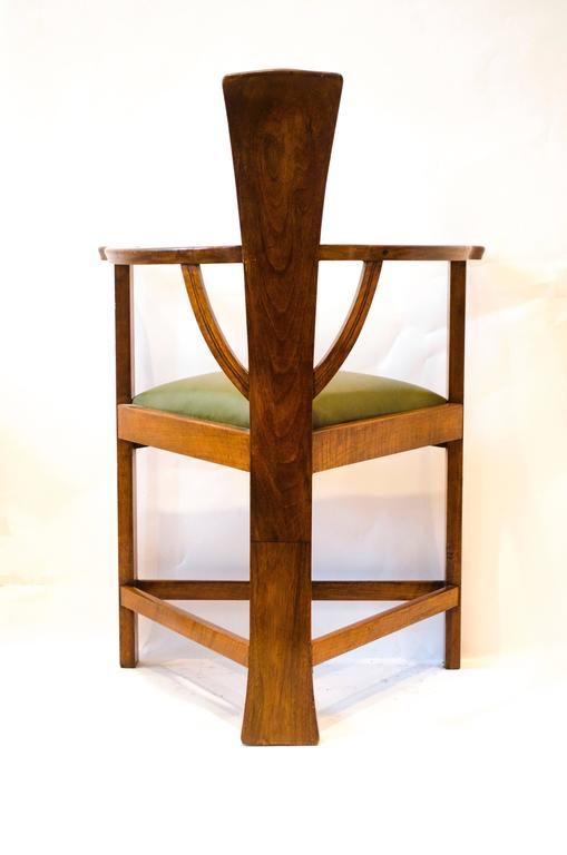 M H Baillie Scott. An Arts and Crafts Walnut Armchair with stylised ...