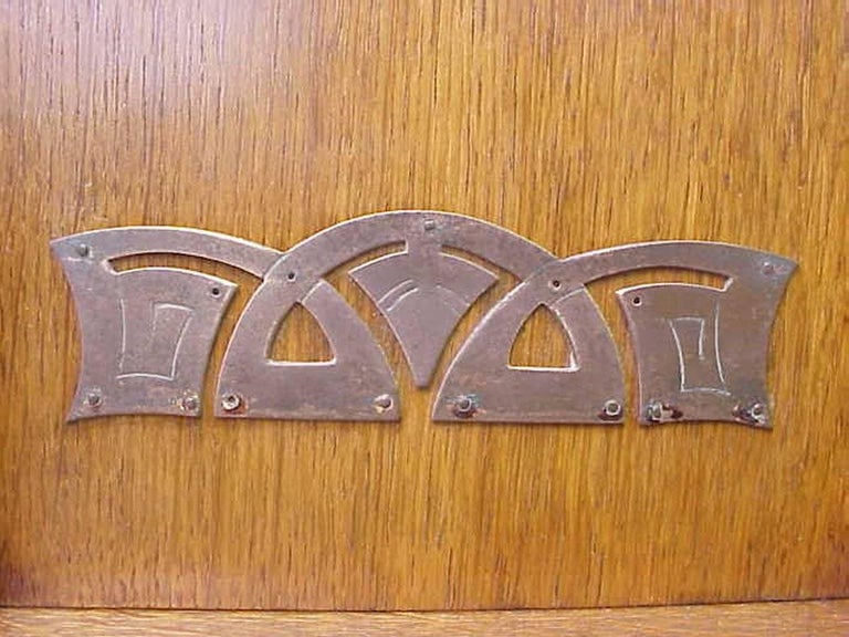 A Continental Arts and Crafts Oak Mantle Clock with Carved Stylised ...