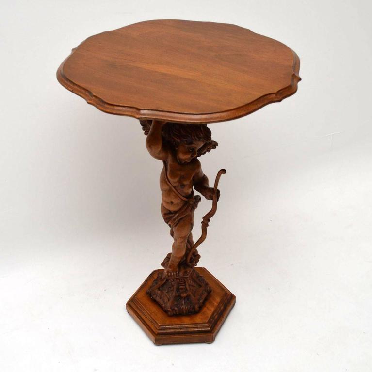 Antique Carved Cherub Mounted Table at 1stDibs