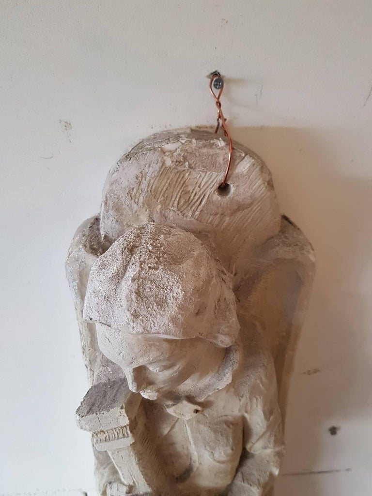 Old Plaster Wall Statue of a Angel Holding a Pillar at 1stDibs