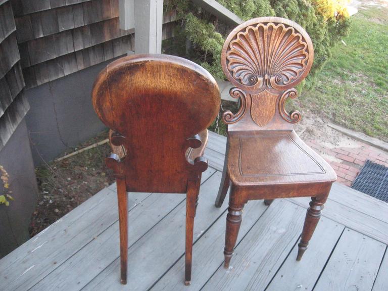 Pair of 19th Century English Oak Shell Back Hall Chairs at 1stDibs