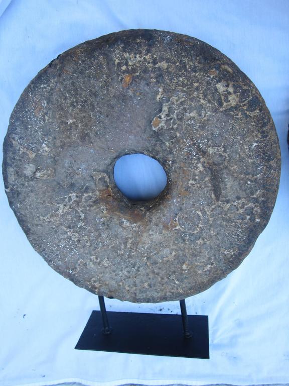 Two Millstones on Iron Bases For Sale at 1stDibs