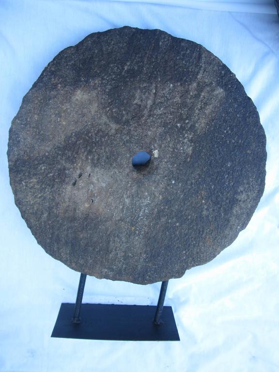 Two Millstones on Iron Bases For Sale at 1stDibs