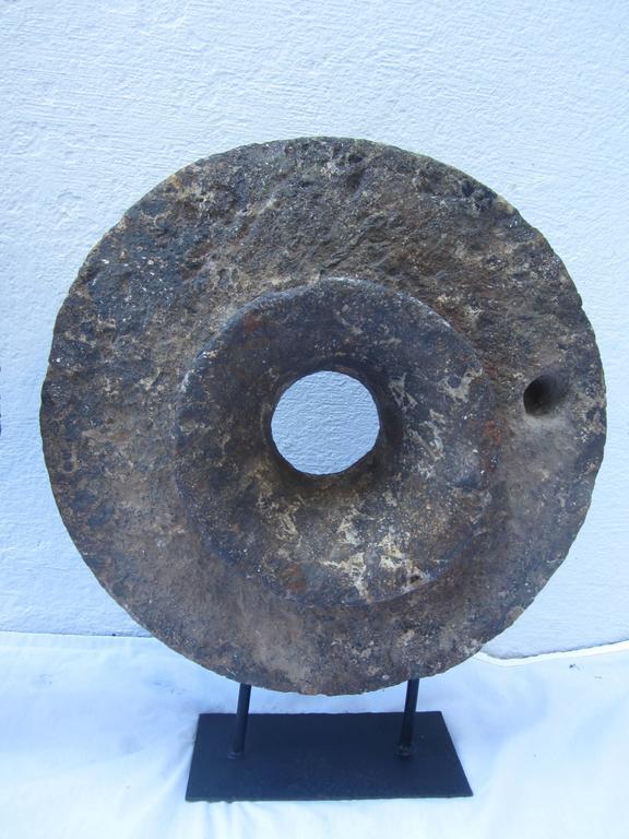 Two Millstones on Iron Bases For Sale at 1stDibs