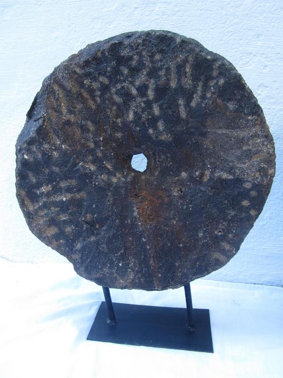 Two Millstones on Iron Bases For Sale at 1stDibs
