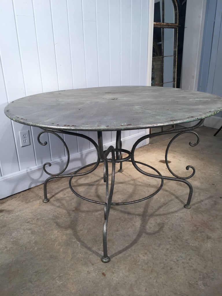 French Wrought Iron Round Dining Table with Scrolled Base at 1stDibs