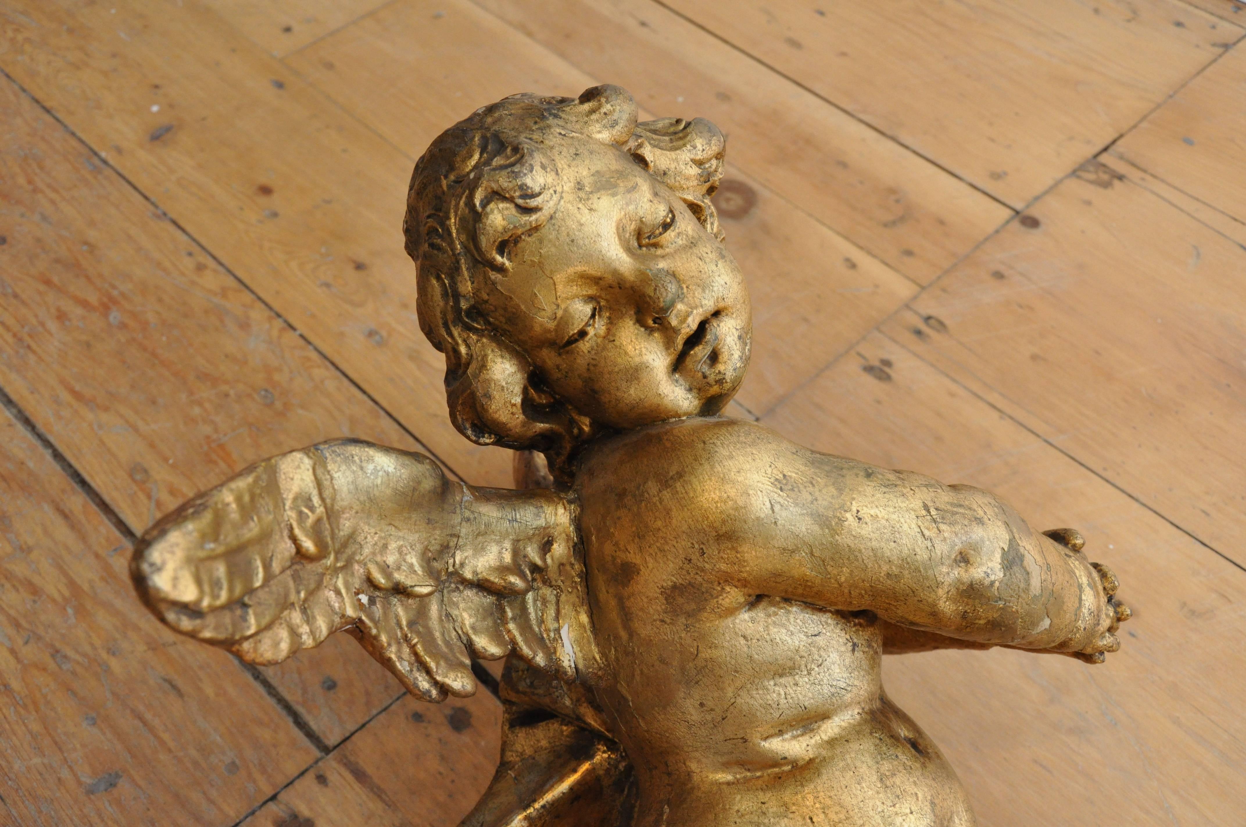 Pair of Italian Baroque Carved and Giltwood Cupids at 1stDibs